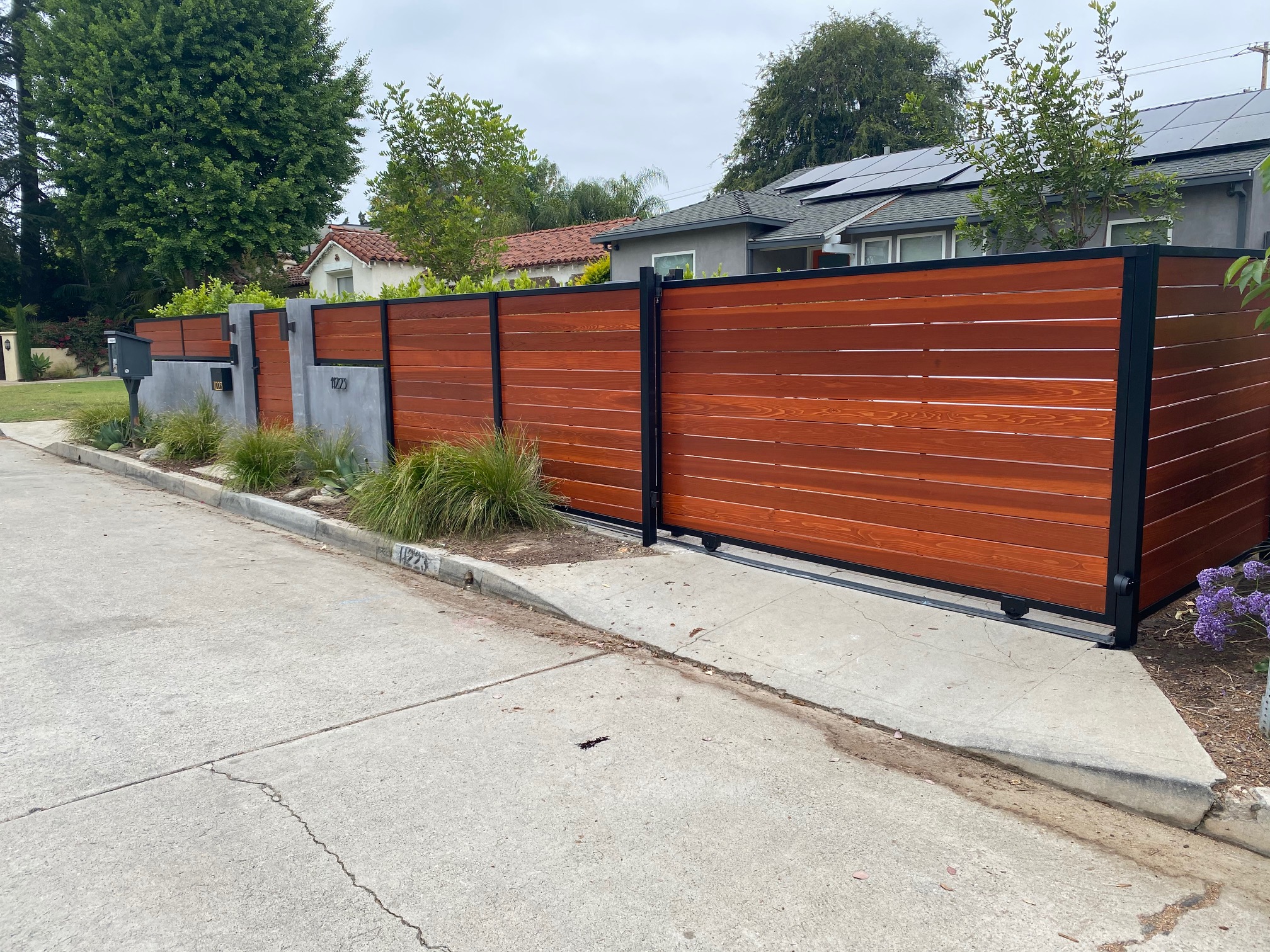 Electric driveway gates with solar panel