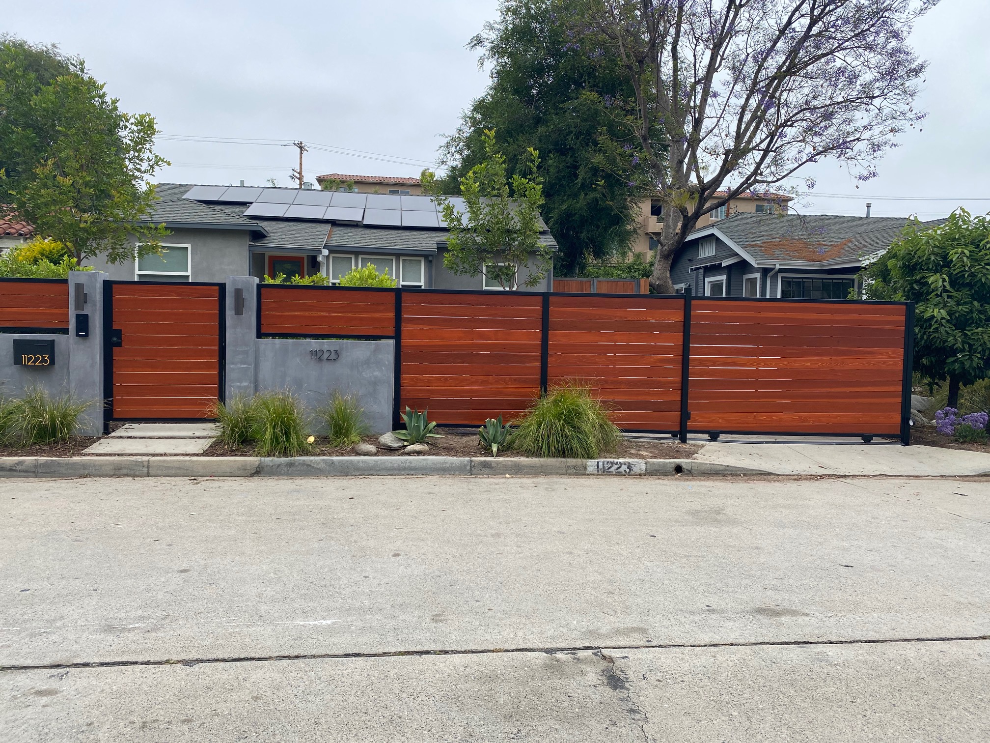 Electric driveway gates with solar panel
